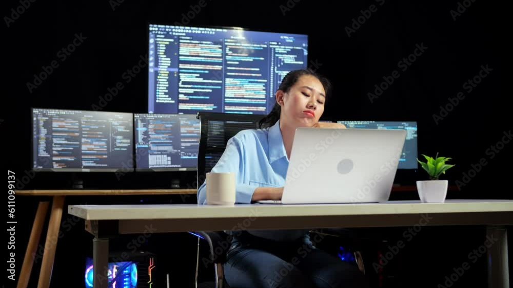 Asian Female Programmer Yawning While Writing Code By A Laptop Using ...