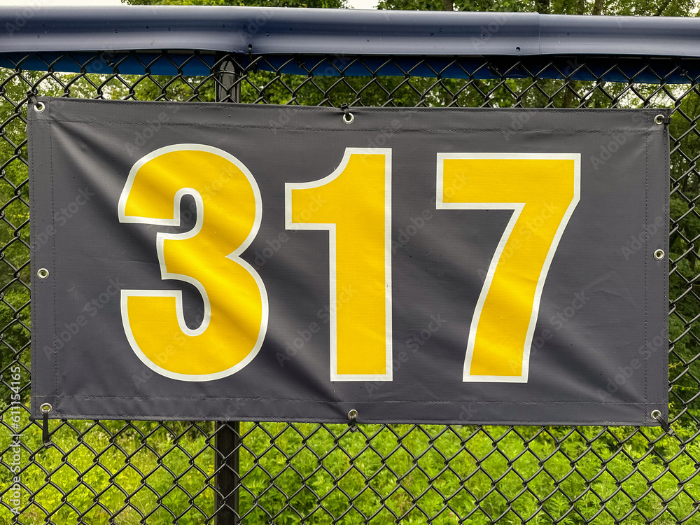 317 foot ft baseball field distance sign in yellow and black mounted on ...