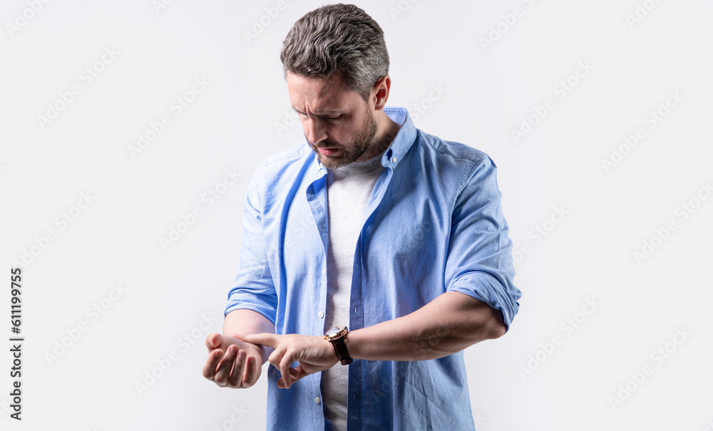 man measuring pulse on wrist. mature man with pulse on wrist. man check ...