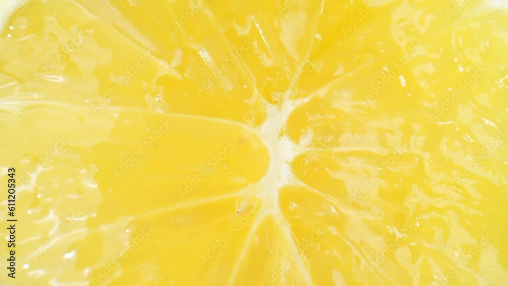 The captivating macro video featuring a half lemon. The camera plunges ...
