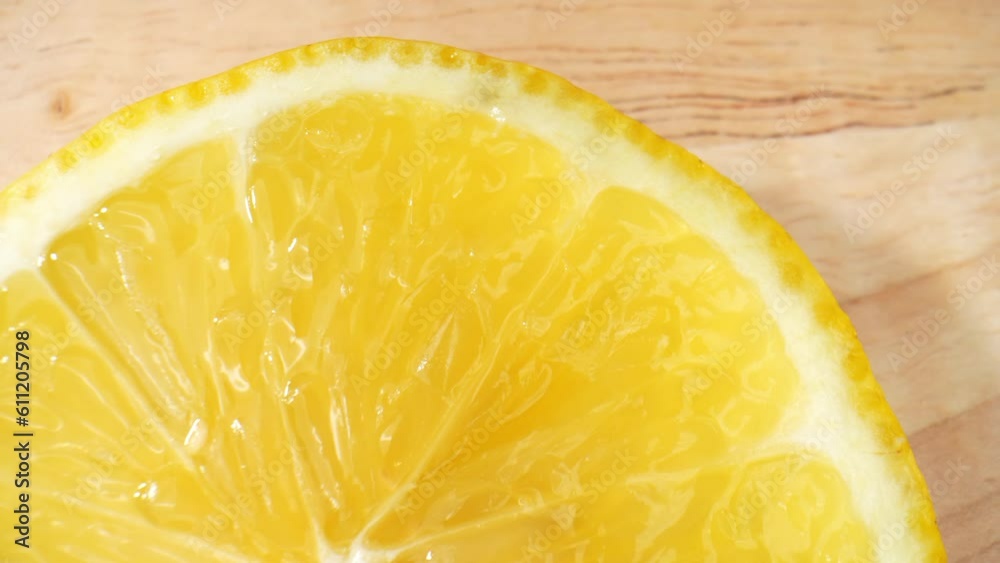 A macro video captures the intricate details inside a lemon, revealing ...