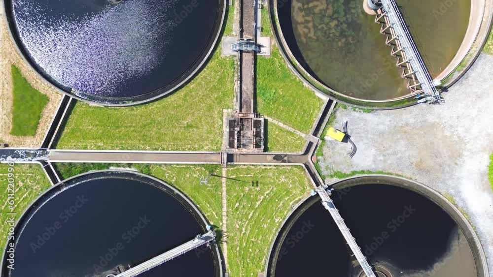 Aerial top view of circular ponds in wastewater treatment plant and ...