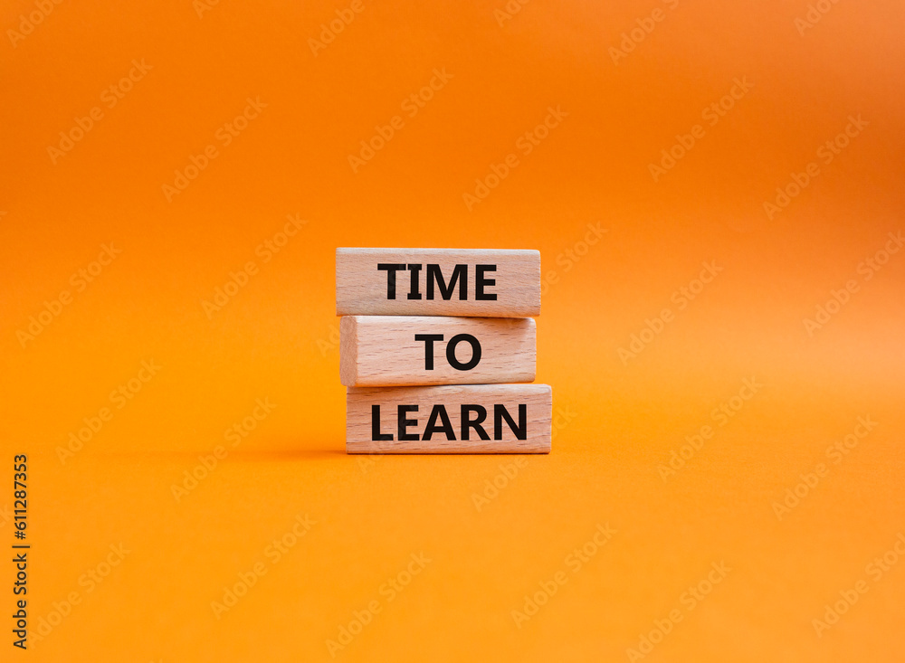Time to learn symbol. Wooden blocks with words Time to learn. Beautiful ...