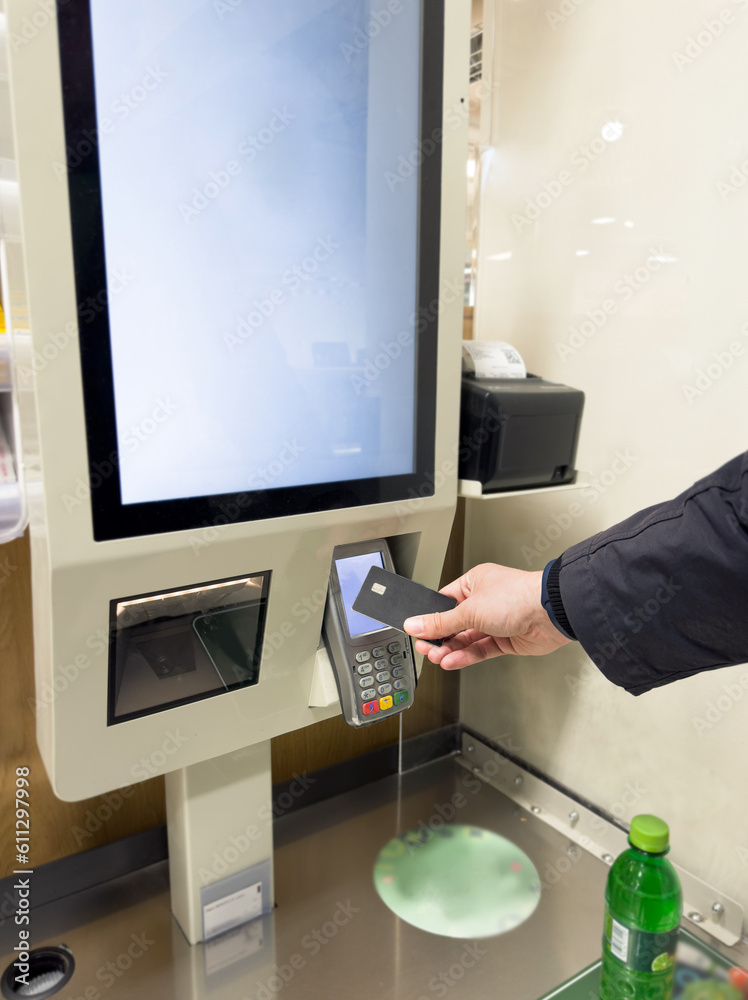 Customer pays his purchase at the supermarket,self checkout systems in retail stores,Barcode ...