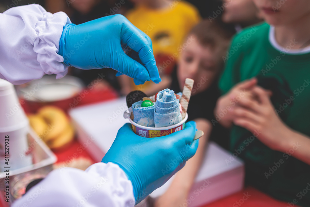 Rolled thai ice cream preparation, process of cooking coloured fried ...