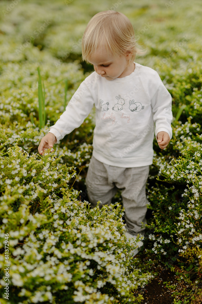 Curious child embracing the enchantment of a beautiful park, her small ...