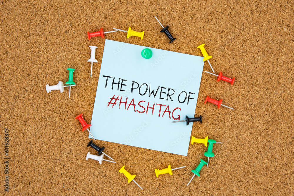 The power of hashtag text on light blue post-it paper pinned on ...
