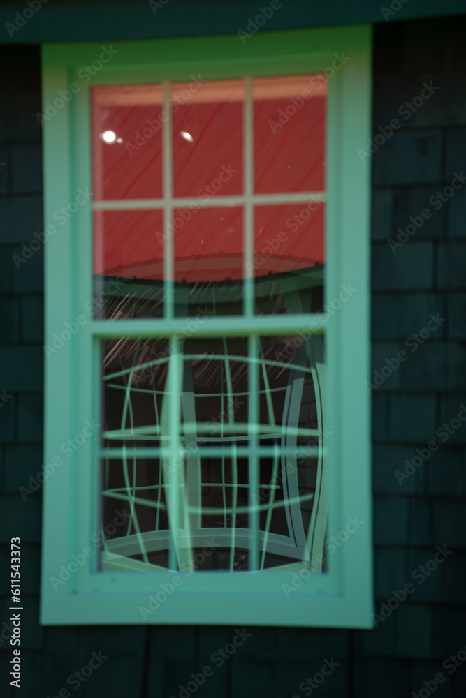 reflection in window of other windows with distortion from glass square ...