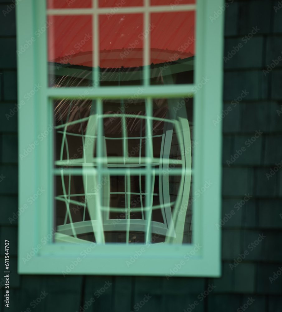 reflection in window of other windows with distortion from glass square ...