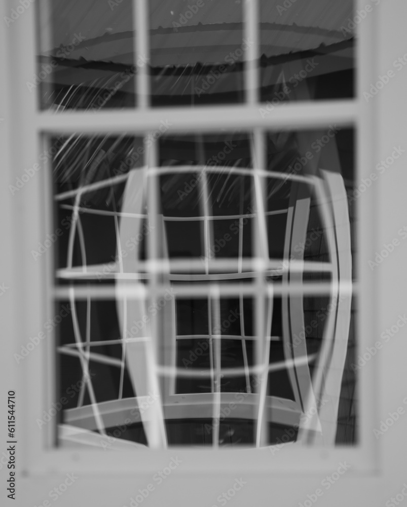 black and white of wooden window frame glass reflecting other windows ...