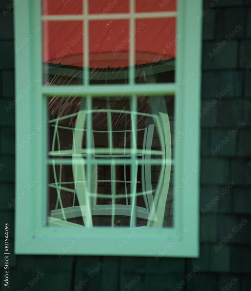 reflection in window of other windows with distortion from glass square ...