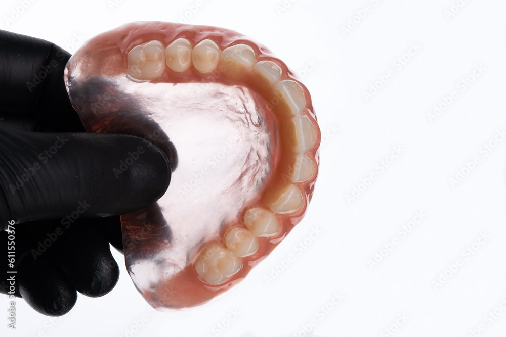 Occlusal view of complete upper denture isolated on white background ...