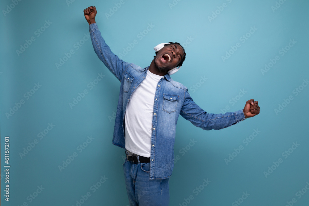 cool dude american man with dreadlocks in a denim jacket relaxes to ...