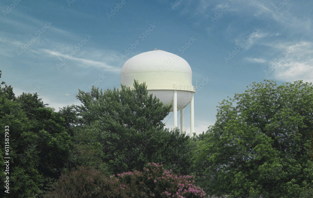 A towering cylindrical structure elevated on sturdy legs. Stores water ...