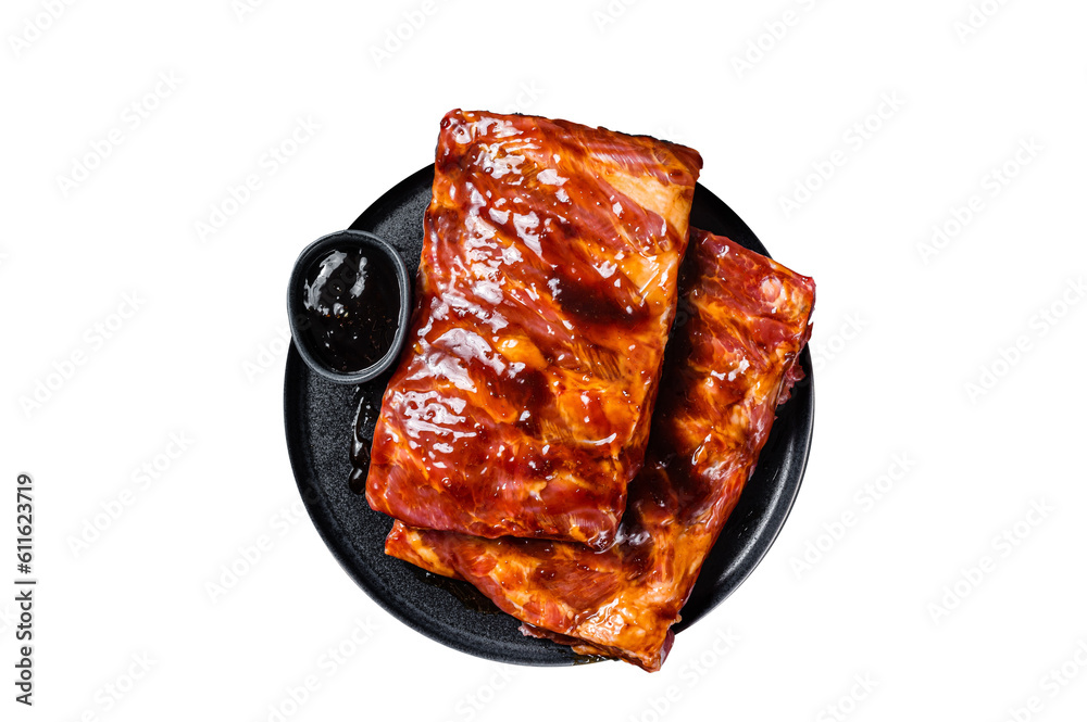 Ready for BBQ raw pork spare ribs with barbecue sauce. Isolated ...