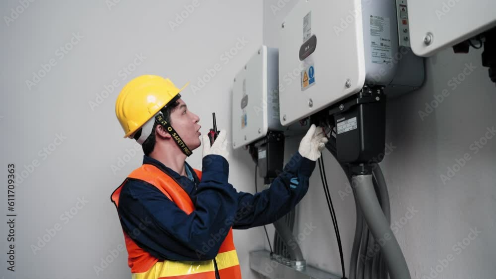 Asian technical man checking circuit board repair and maintenance panel ...