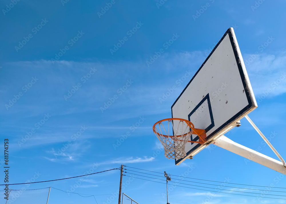 basketball hoop seen from the basketball court in the background blue ...