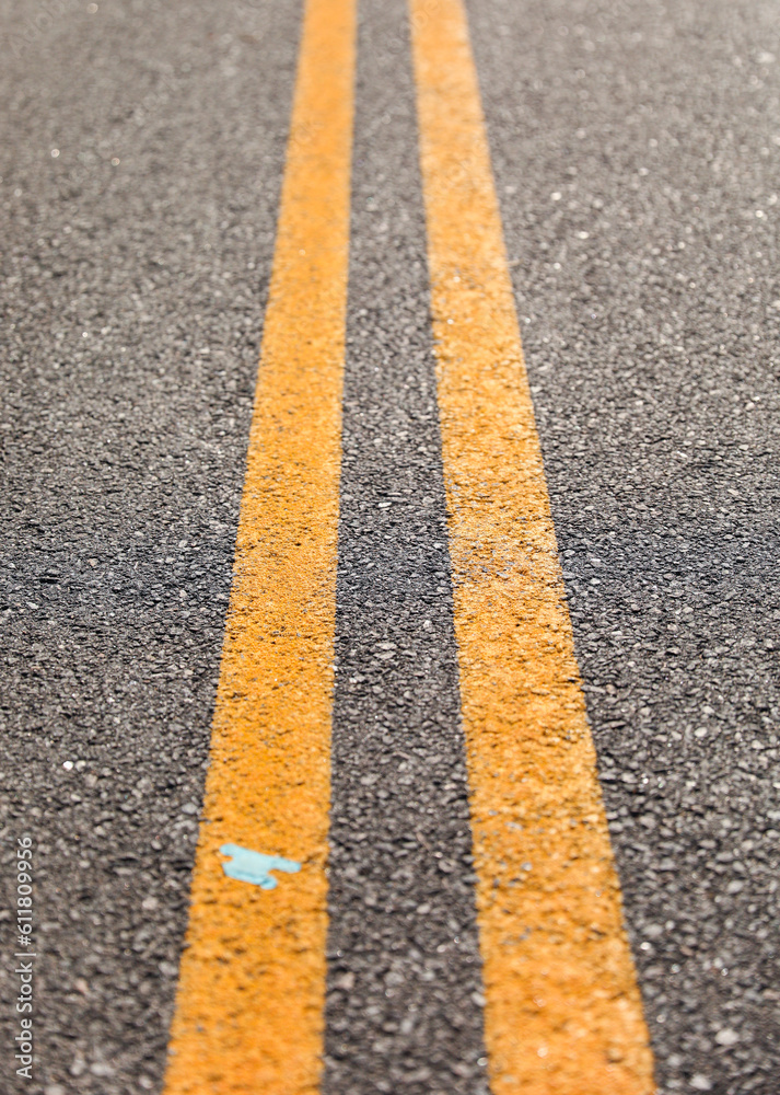 Double yellow line streets symbolize traffic regulation, no passing ...