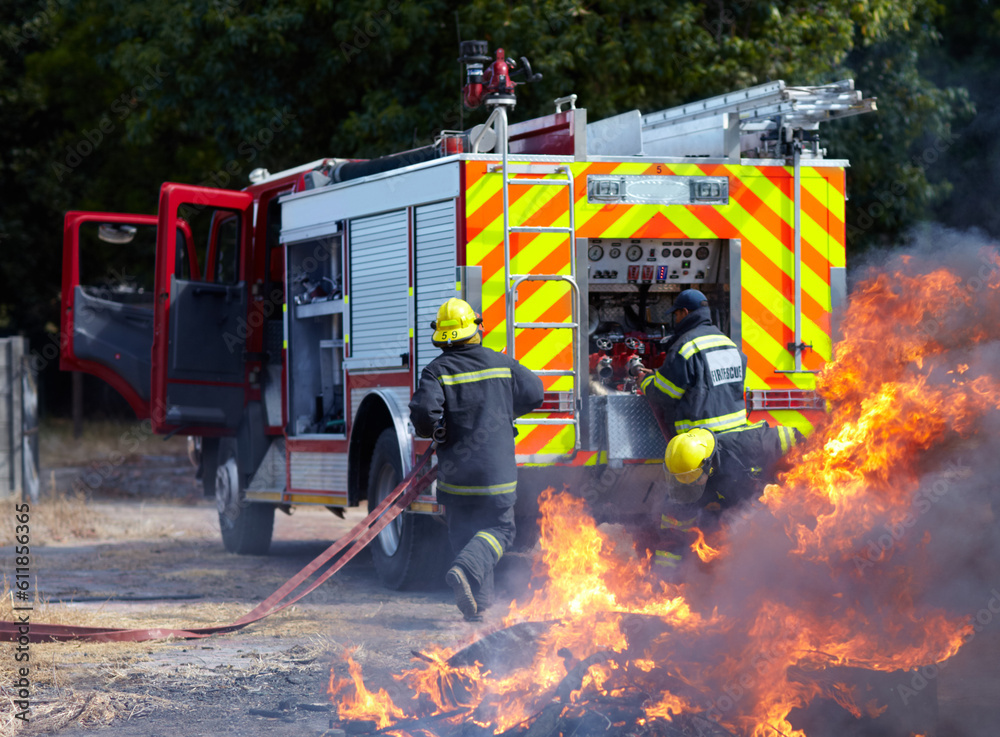 Fire, teamwork and truck with firefighter and emergency in nature for ...