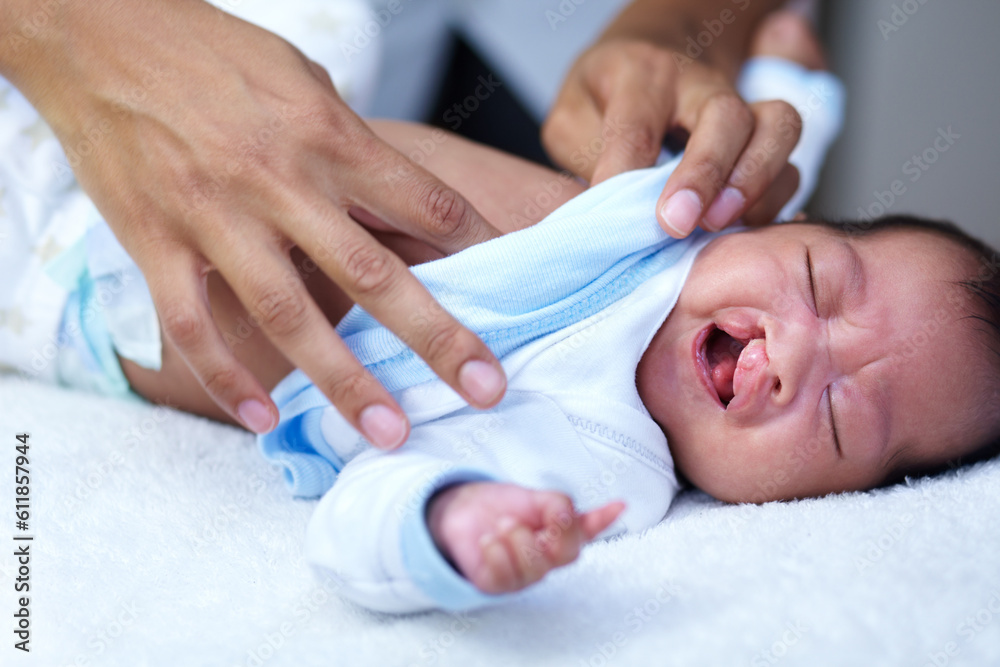 Newborn, cleft palate and mother care for a baby crying in a home bed ...