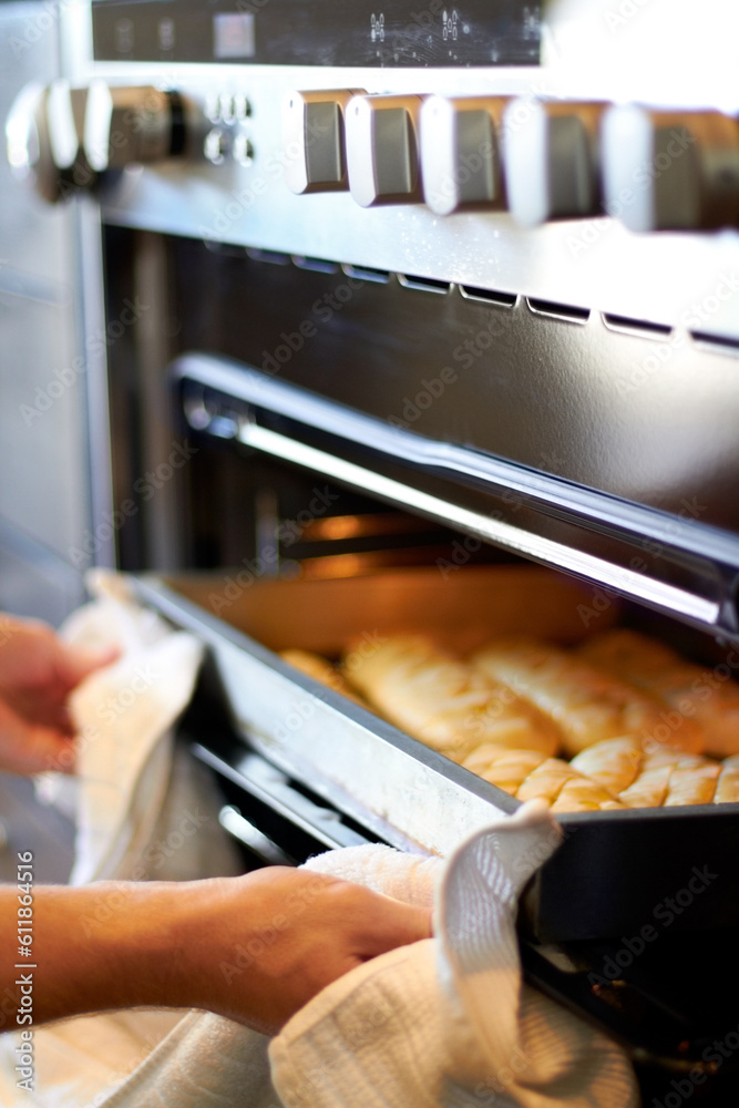 Hands, closeup and tray from oven for bread, baking product or food for ...