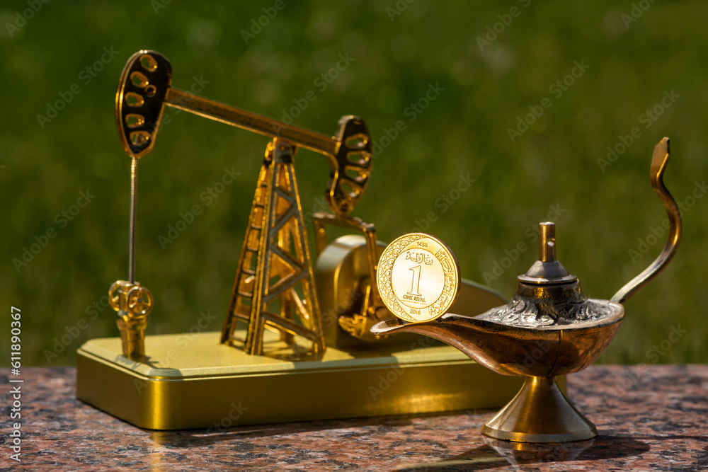 Aladdin's magic lamp, 1 riyal coin of the Kingdom of Saudi Arabia and a ...