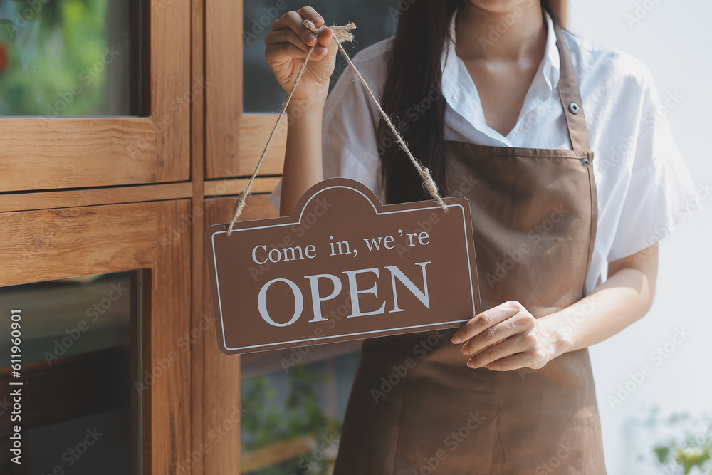 Welcome. Open. barista, waitress woman turning open sign board on glass ...
