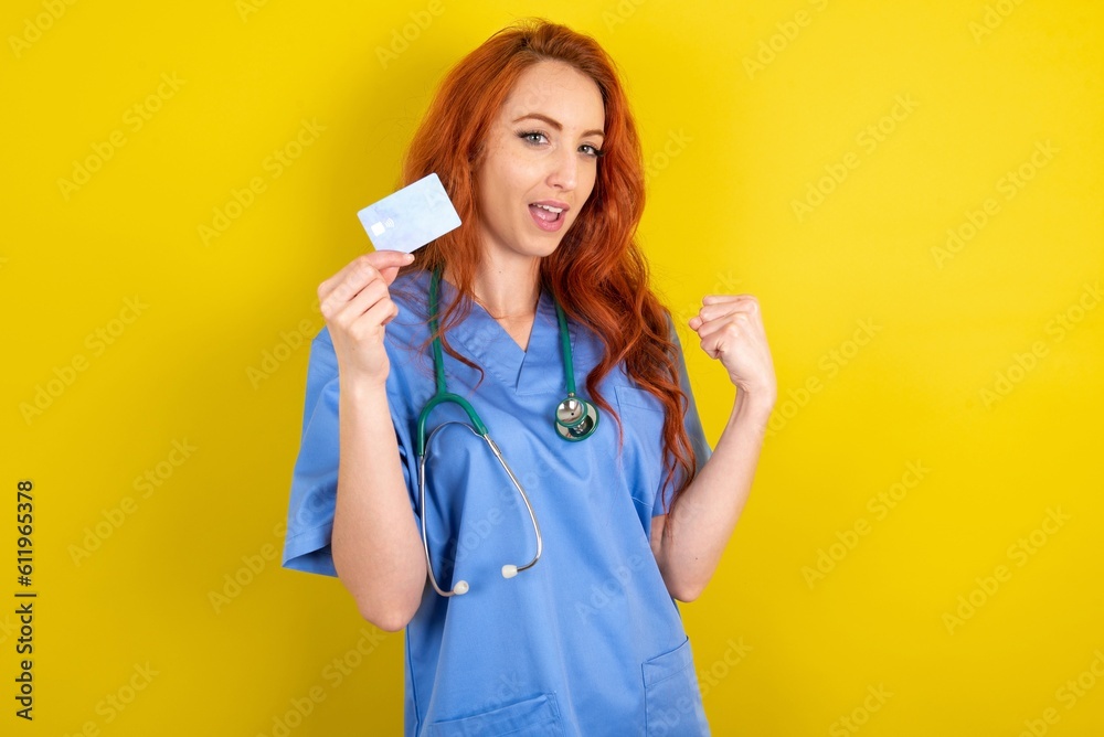 Excited happy positive cheerful smiling redhead doctors woman wearing ...