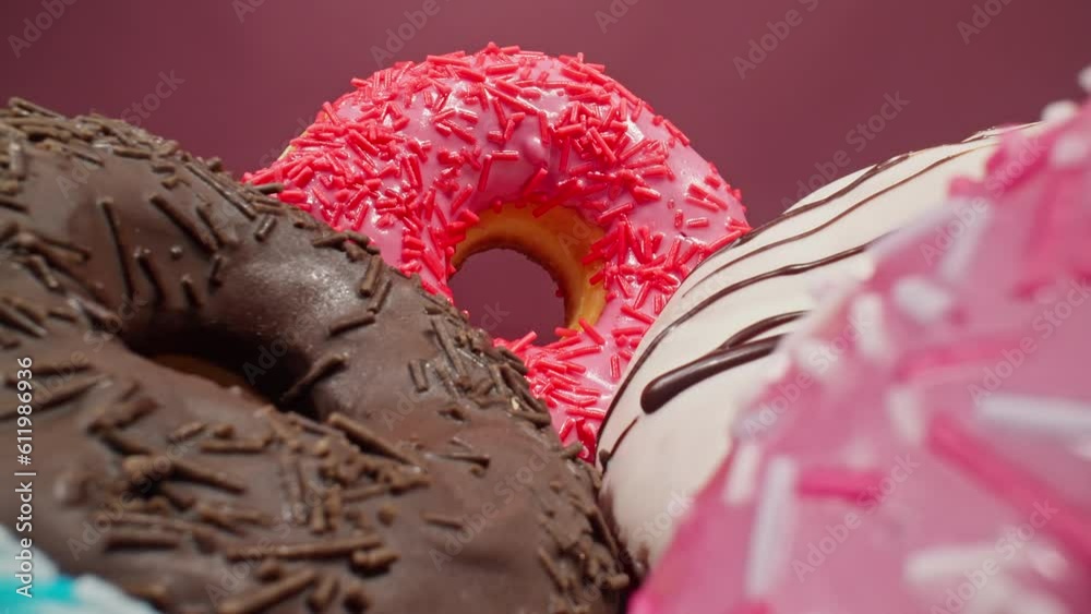 Pile of different delicious donuts. Bakery and food concept. Dolly ...