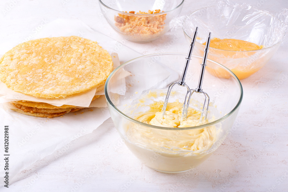 Preparing the buttercream for chopped cake with lemon curd. Beating the ...