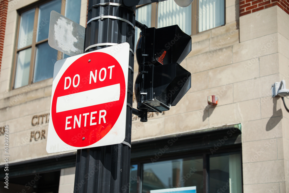 An imposing red 'Do Not Enter' sign stands tall, conveying a powerful ...