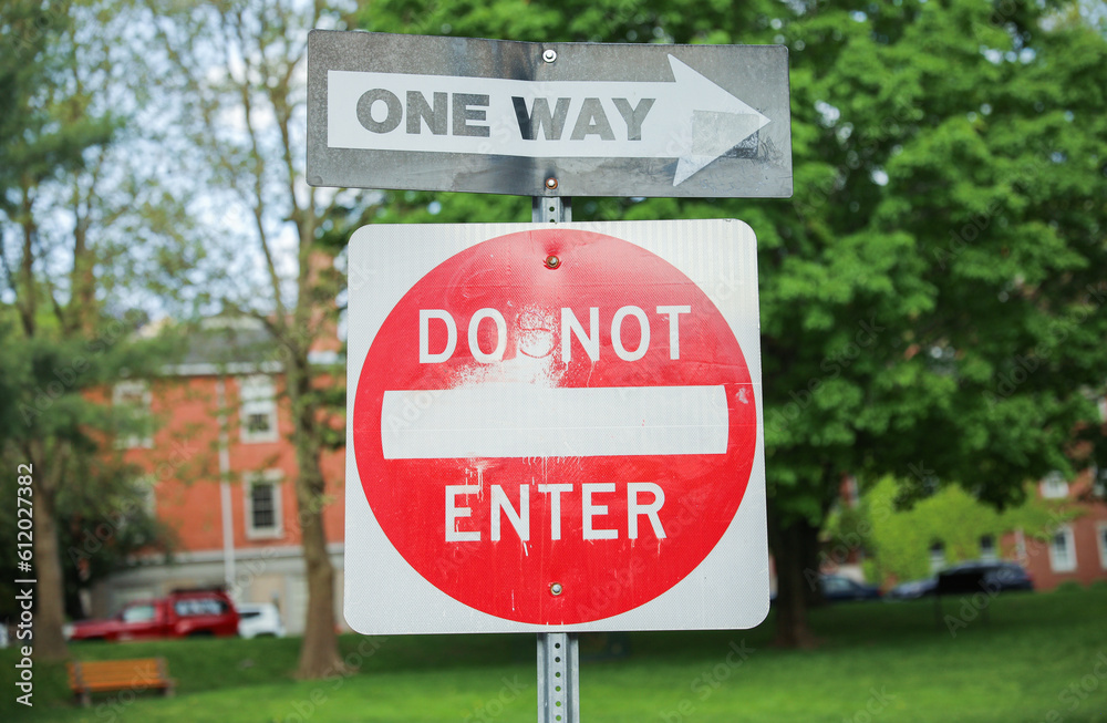 An imposing red 'Do Not Enter' sign stands tall, conveying a powerful ...