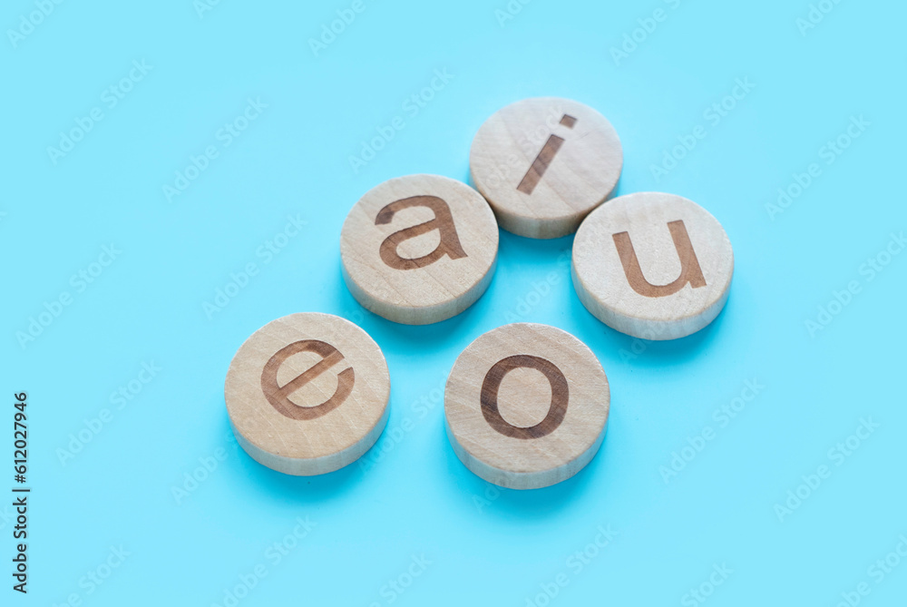Learning english concept.Vowels of AEIOU on a blue background. Stock ...