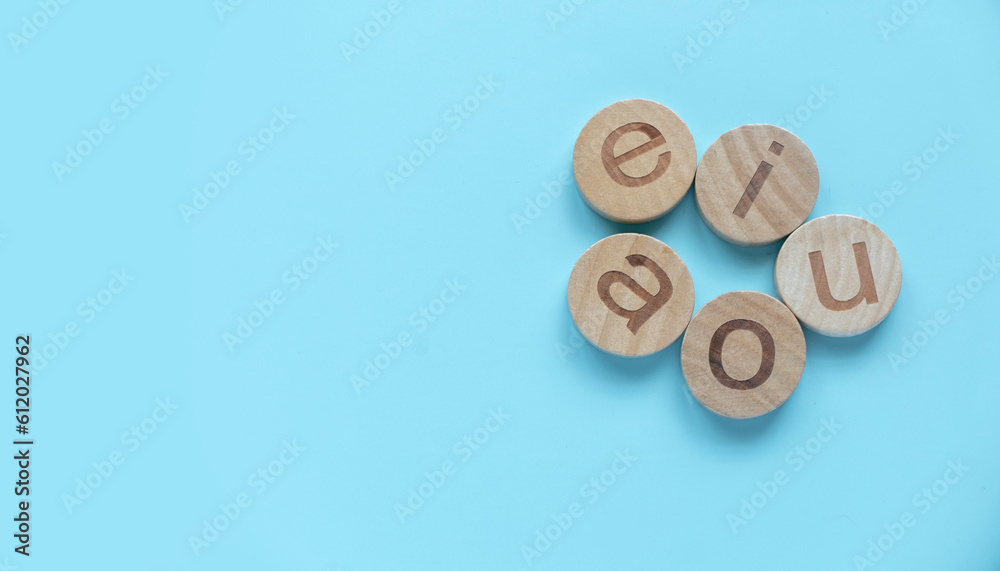 Learning english concept.Vowels of AEIOU on a blue background. Copy ...