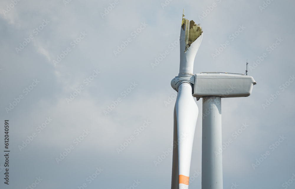 Damaged wind turbine. A windmill with a detached, damaged propeller ...