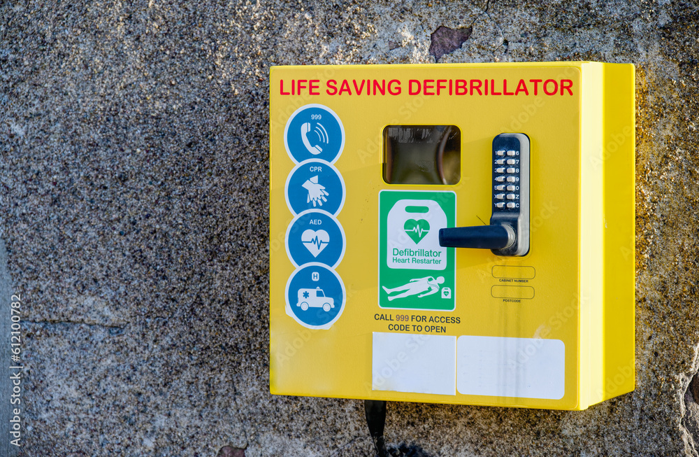 Defibrillator AED on wall in public space for emergency heart ...