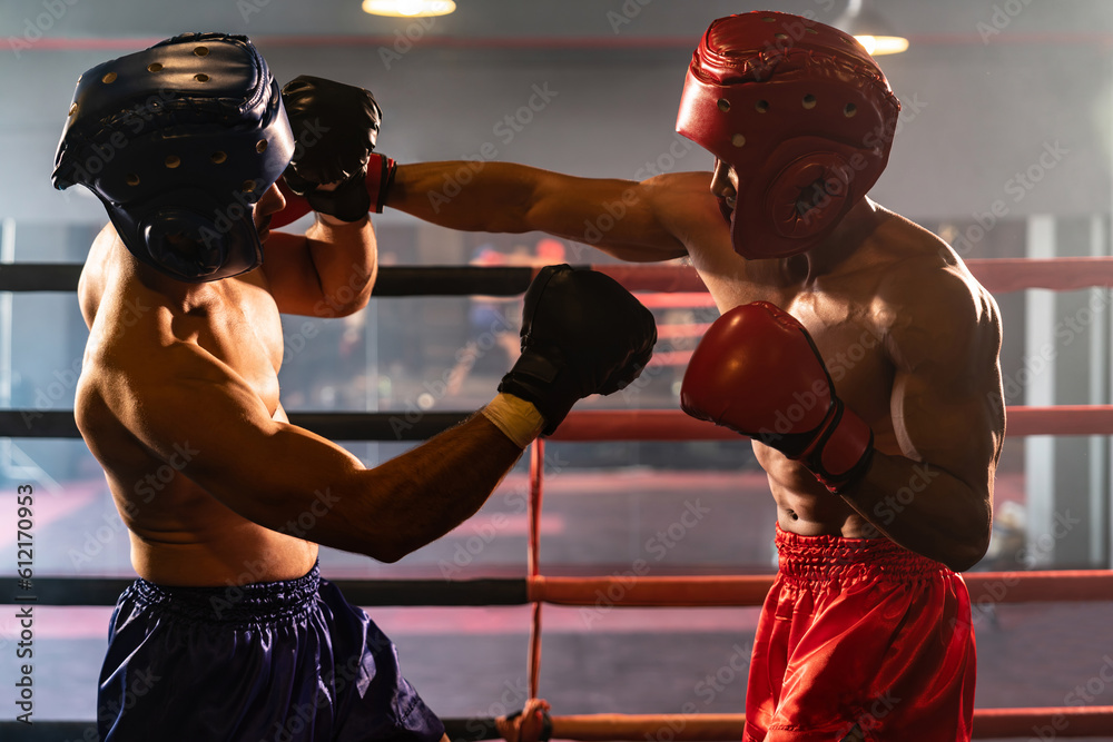Two athletic and muscular body boxers with safety helmet or boxing head ...
