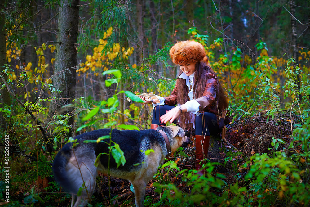Girl in a leather jacket, a big red fox fur hat and with a crossbow in ...