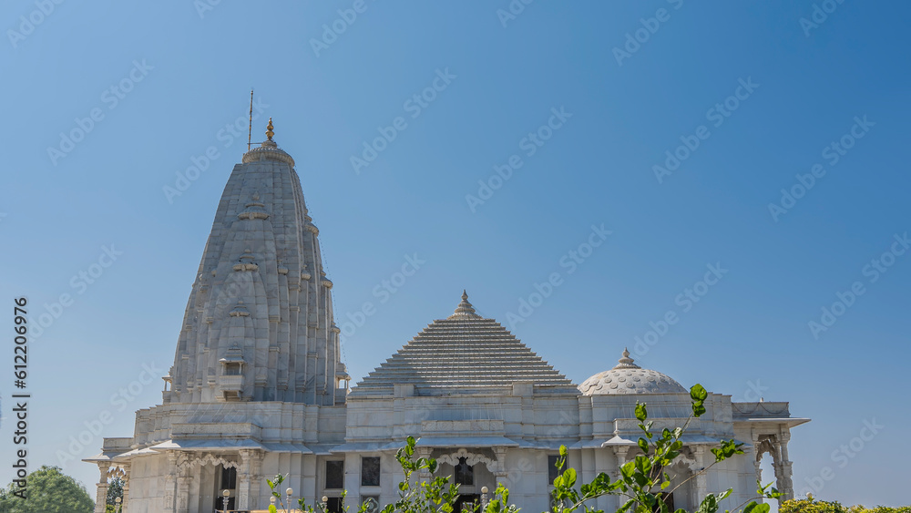 Beautiful white marble temple Birla Mandir- Lakshmi Narayana. Against ...