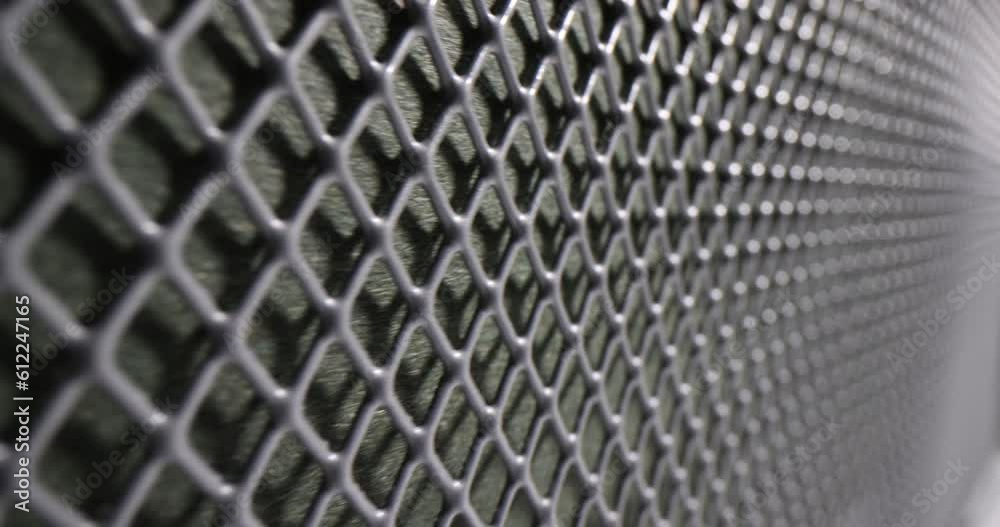 Gray perforated metal mesh industrial background. Dark square mesh and ...