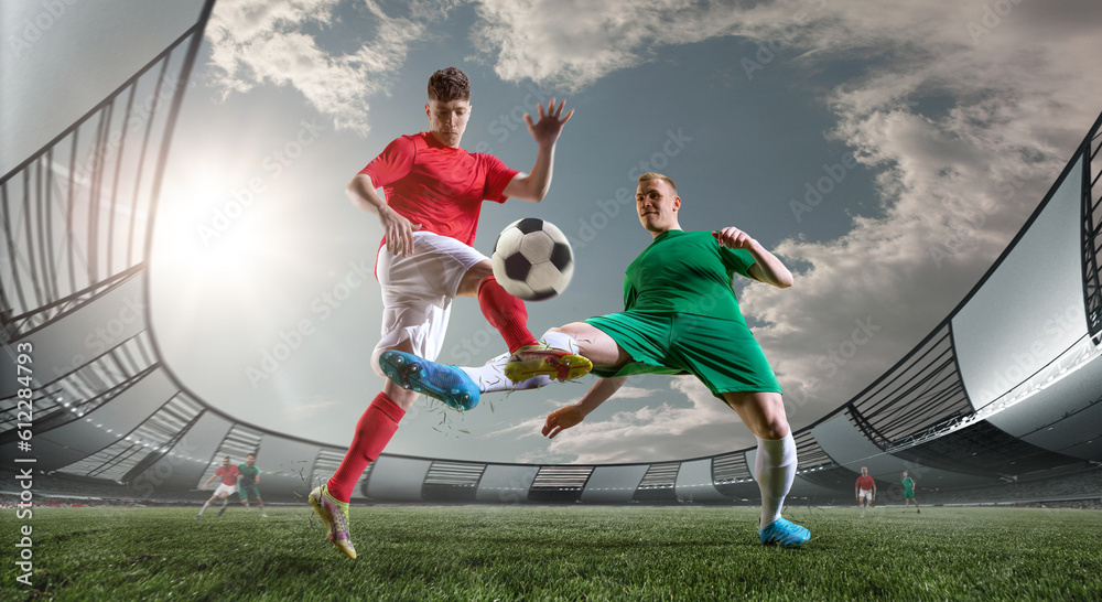Dynamic image of two competitive men, football players in motions ...