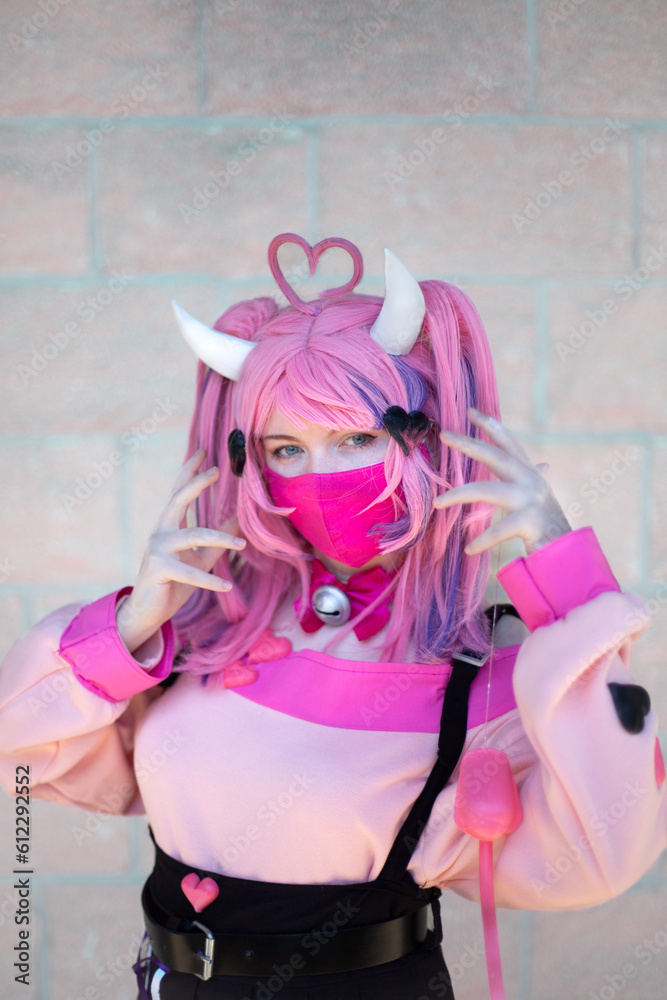 Pretty girl Anime character posing in pink cosplay costume Stock Photo ...