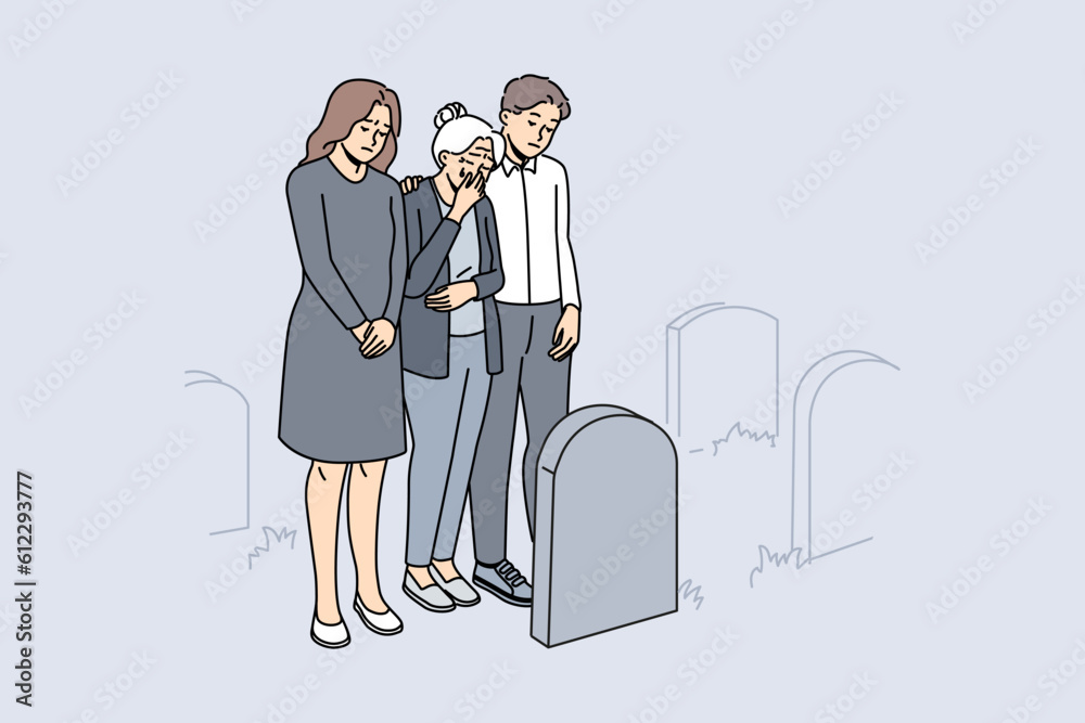 Unhappy family in black clothes crying at relative grave on cemetery ...