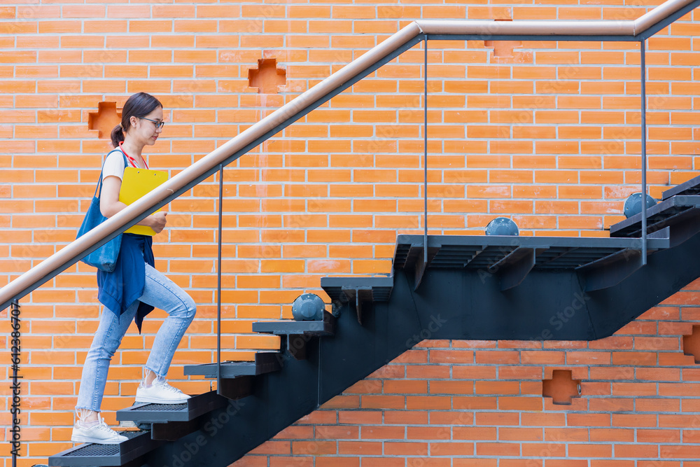 Poster University student walk climb stairs step up in school campus to ...