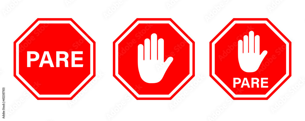 Pare sign (stop sign in Spanish) in red color with a hand sign ...