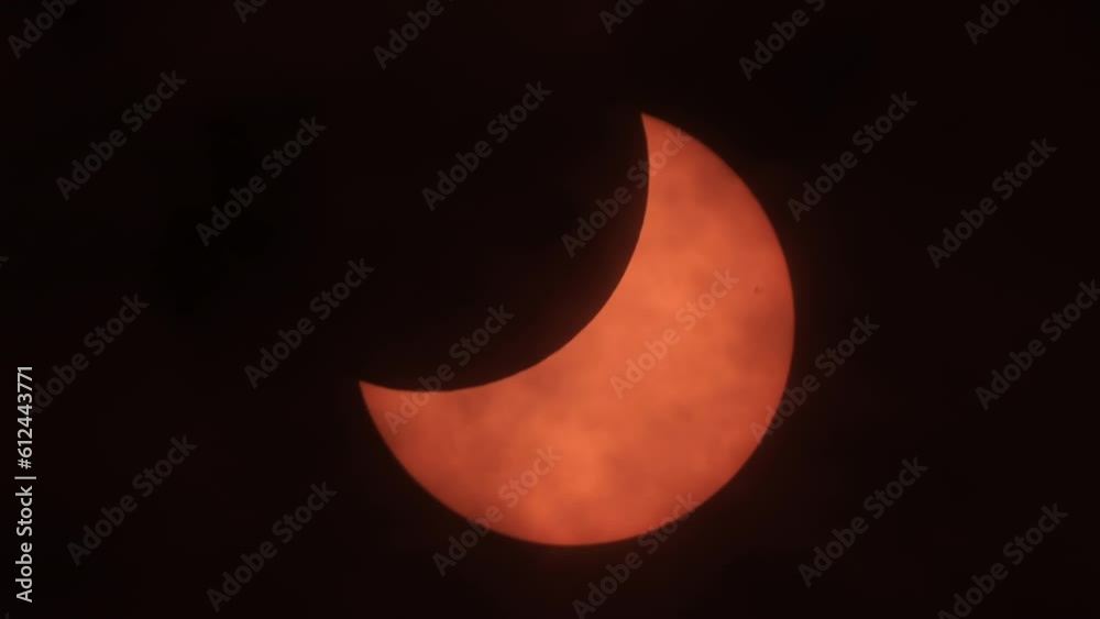 Movement of Clouds in Front of Sun During a Solar Eclipse. Moon Cast ...