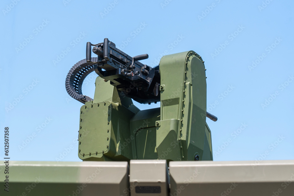.50 cal M2 Browning heavy machine gun on top of a green camouflage ...