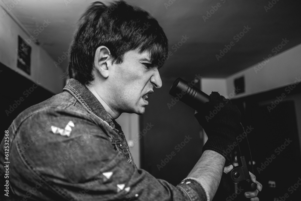 Passionate and intense young rocker vocalist unleashing raw energy ...