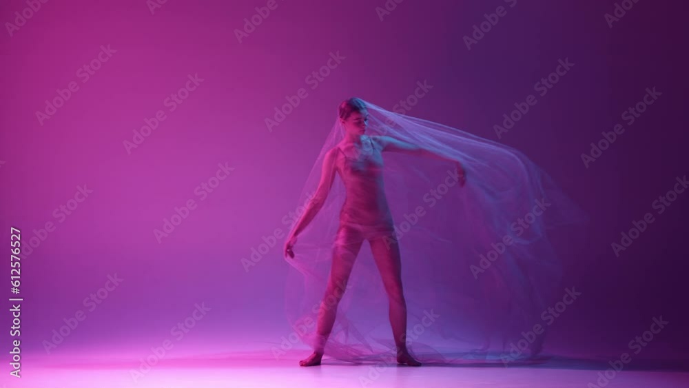 Tender, talented young girl, ballerina in beige bodysuit dancing with ...