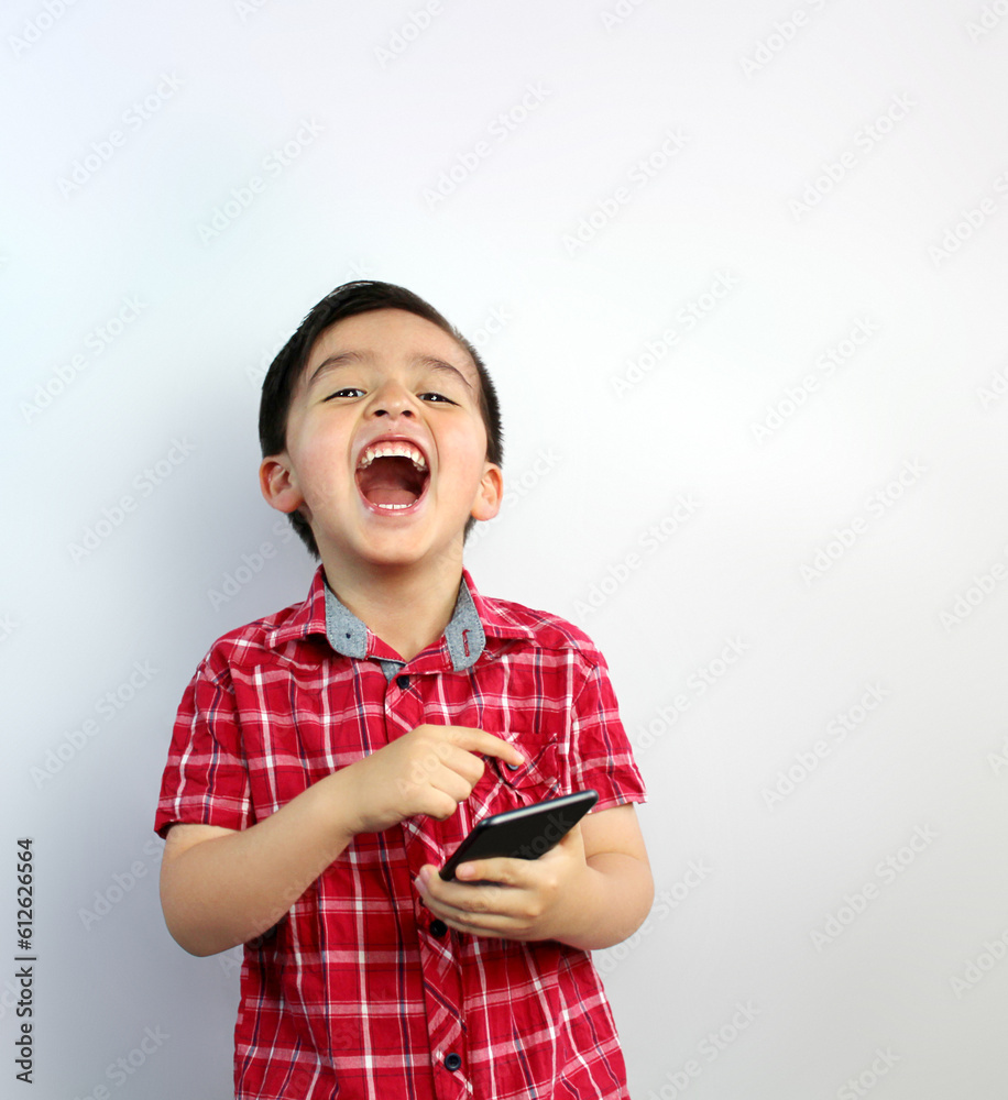 child pointing out cellphone, big smile, laughing out loud, raising its ...